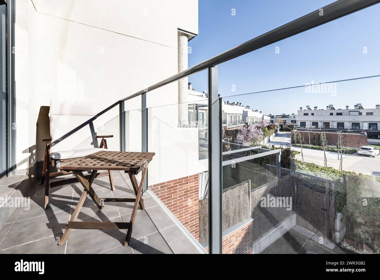 A small terrace with views in a two-story building with a small folding ...