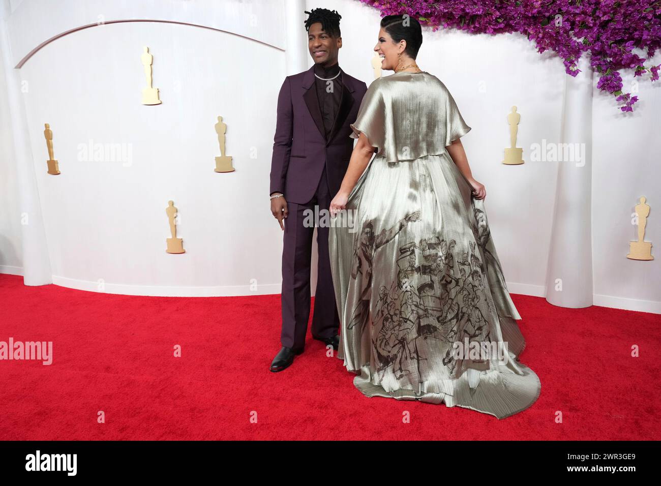 Jon Batiste, left, and Suleika Jaouad arrive at the Oscars on Sunday ...
