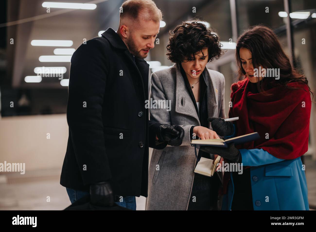 Reviewing three colleagues examining hi-res stock photography and ...