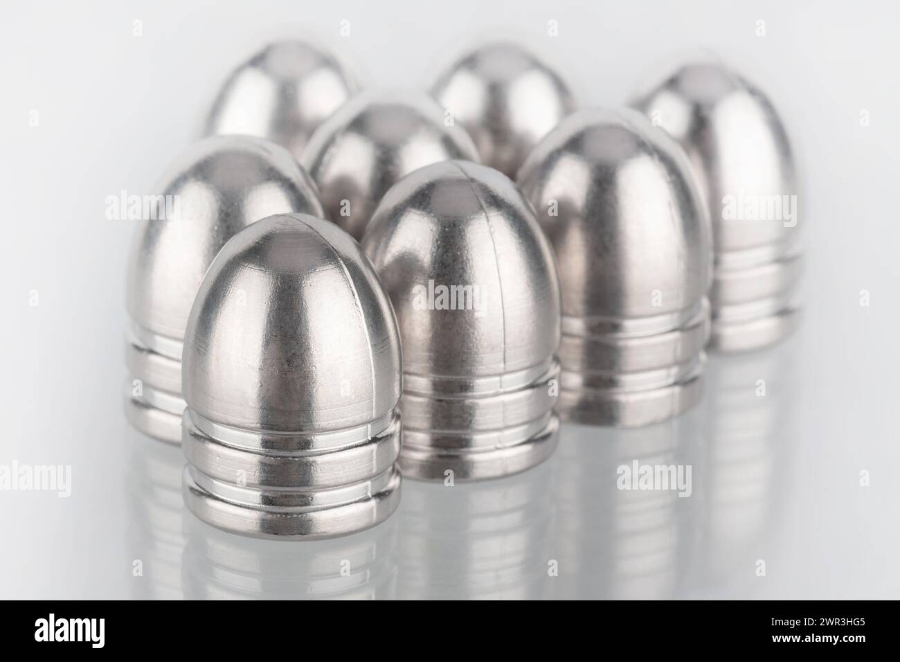 silver bullets for muzzle guns on white background Stock Photo - Alamy