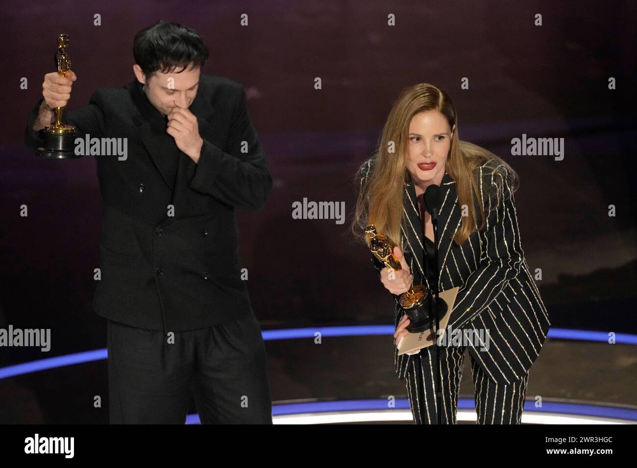 Arthur Harari, left, and Justine Triet accept the award for best ...