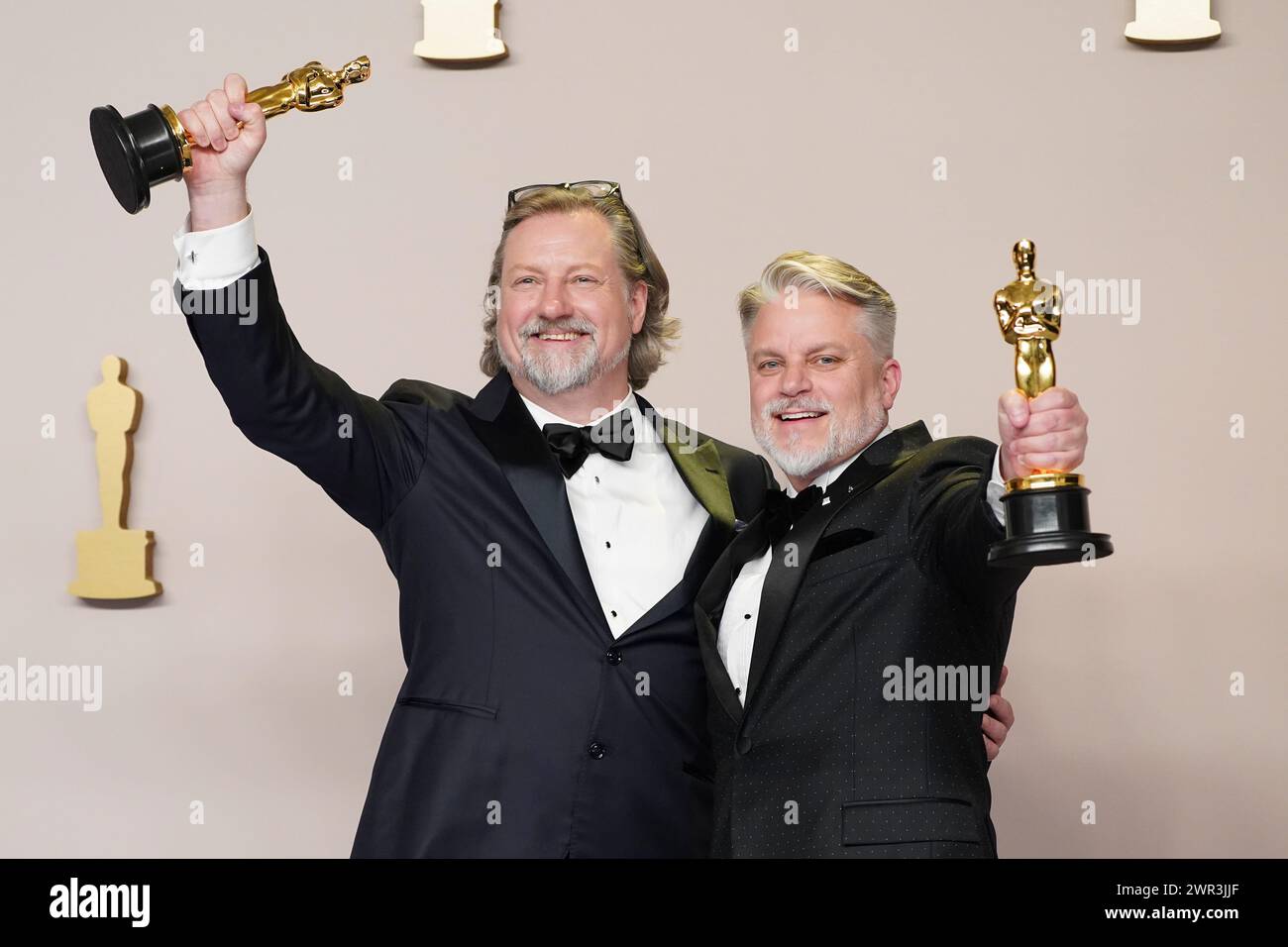 Dave Mullins, left, and Brad Booker pose in the press room with the ...