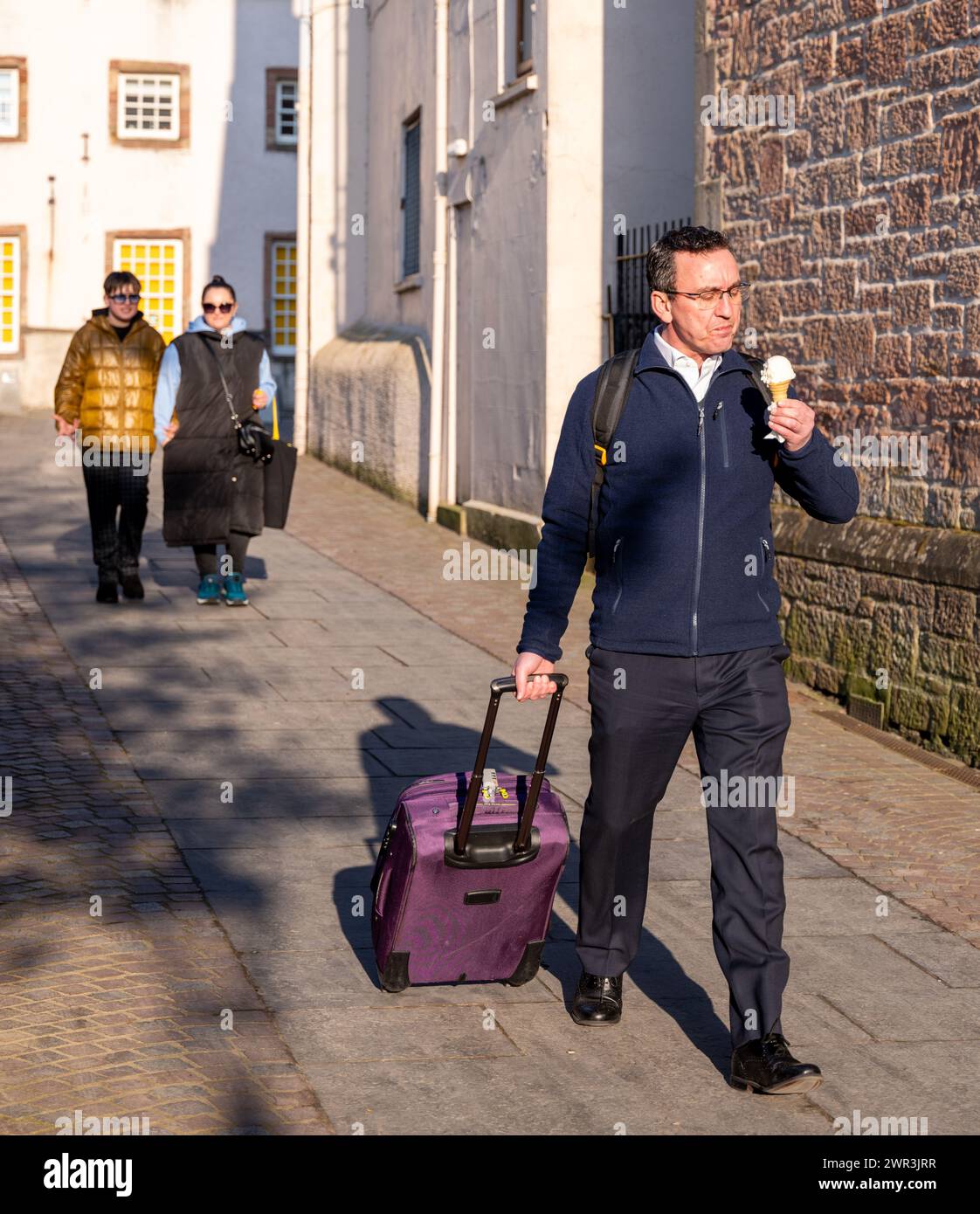 7 March 2024. Inverness,Scotland. This is a man with his luggage ...