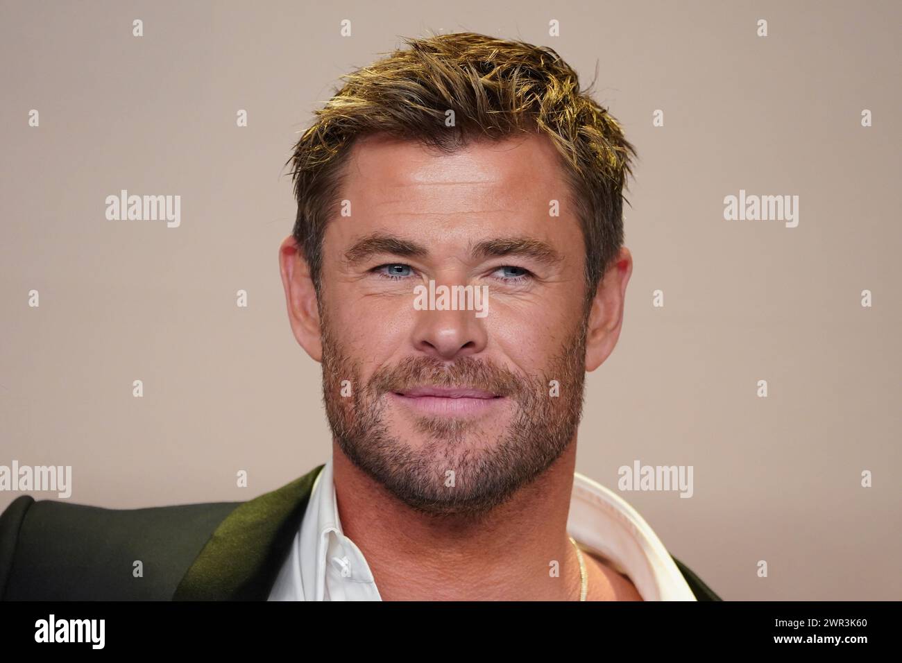 Chris Hemsworth poses in the press room at the Oscars on Sunday, March ...