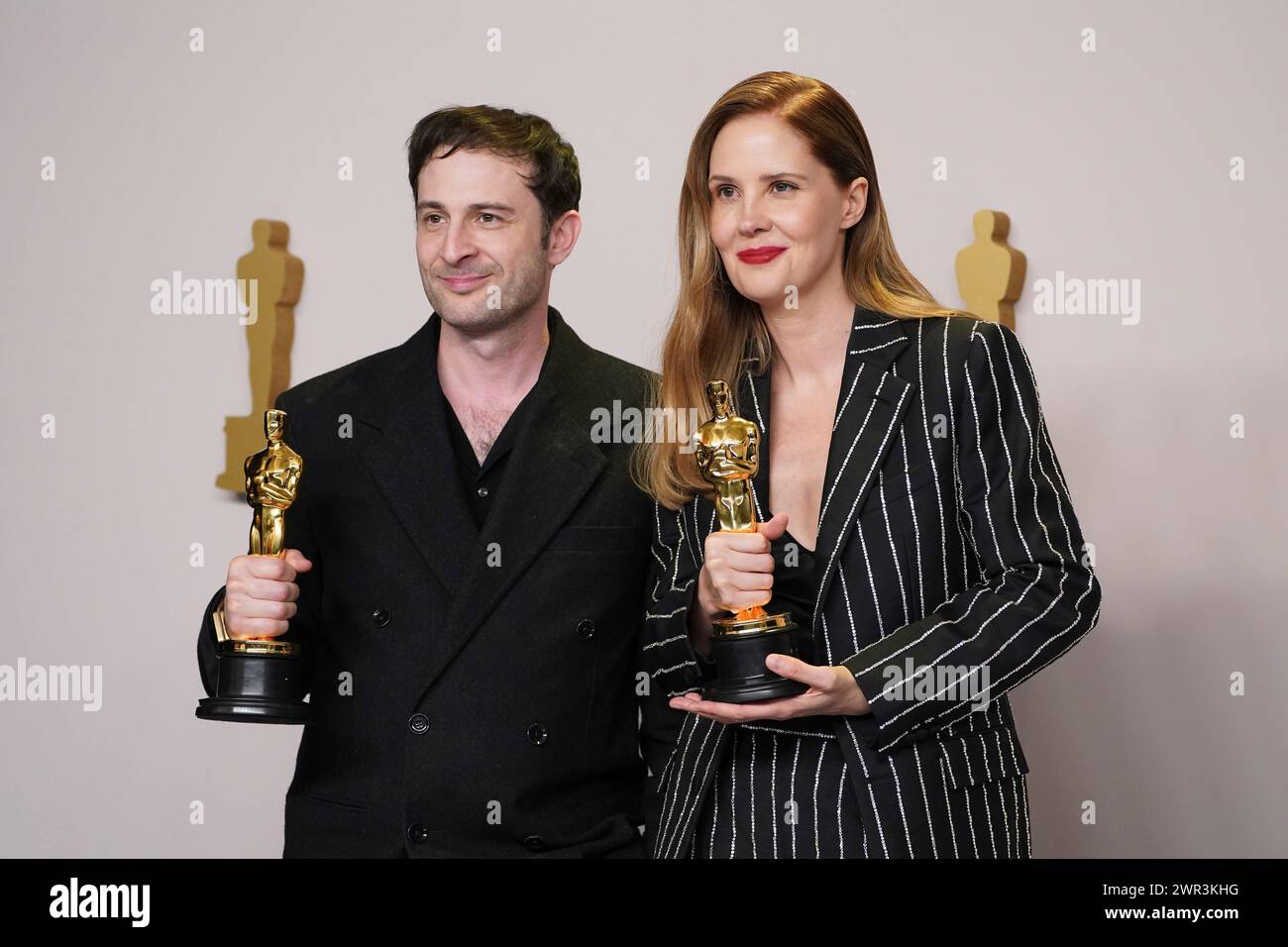 Arthur Harari, left, and Justine Triet pose with the award for best ...
