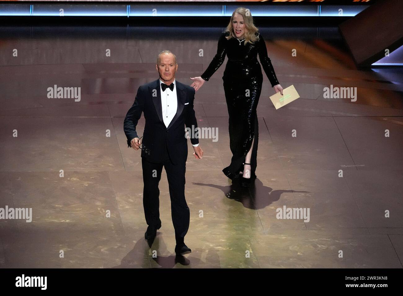 Michael Keaton, left, and Catherine O'Hara speak during the Oscars on ...