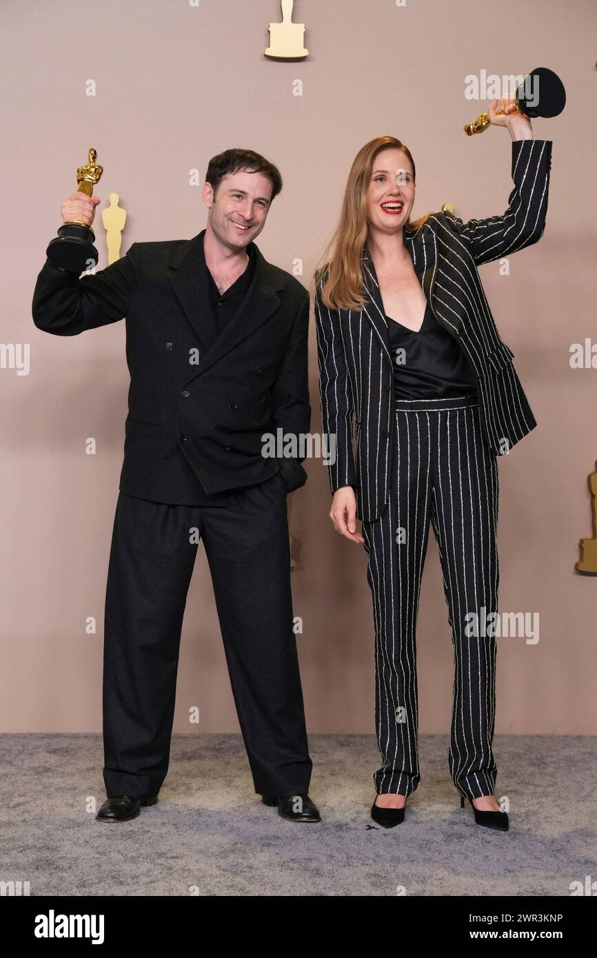 Arthur Harari, left, and Justine Triet pose with the award for best ...