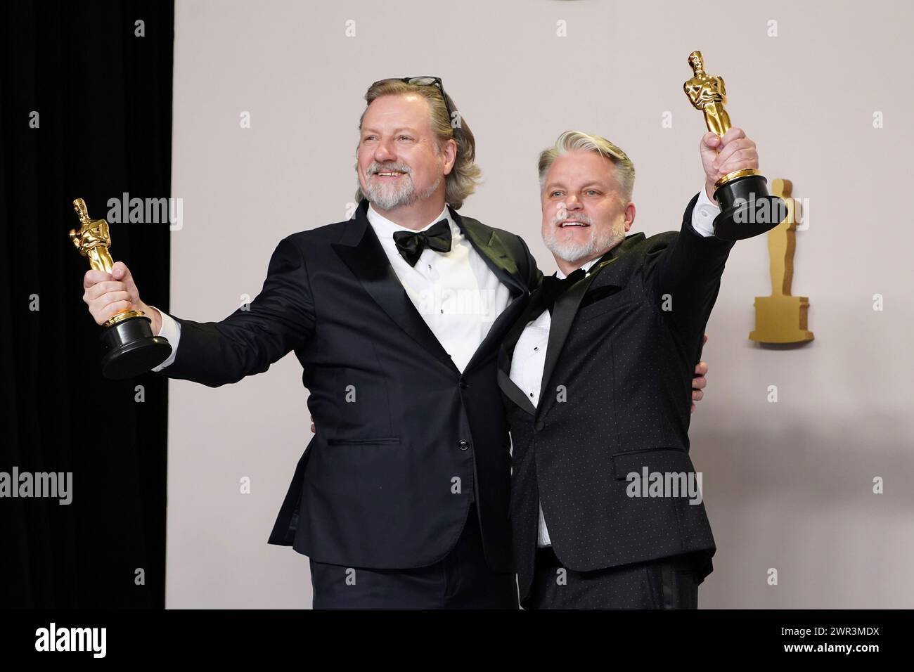 Dave Mullins, left, and Brad Booker pose in the press room with the ...
