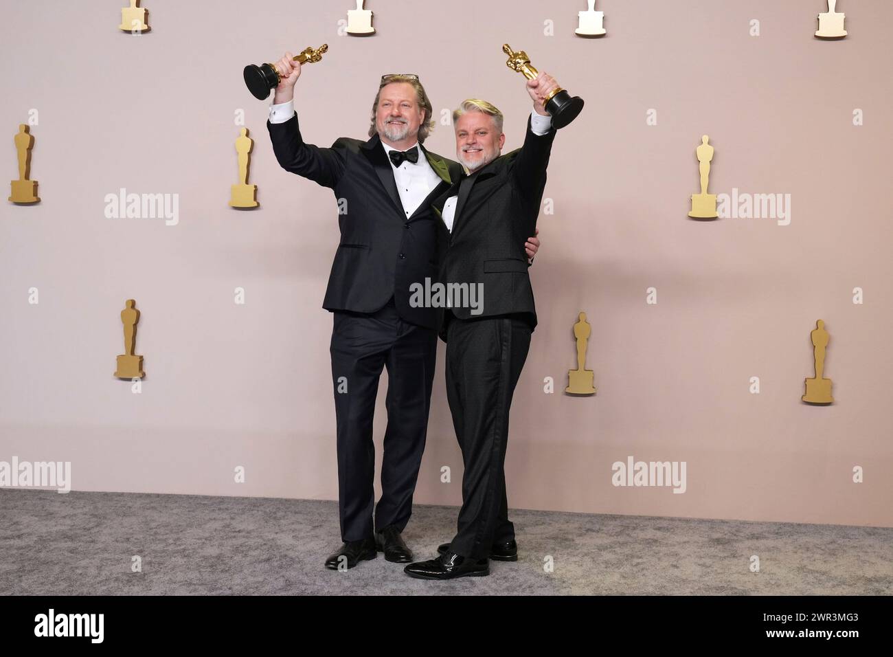 Dave Mullins, left, and Brad Booker pose in the press room with the ...