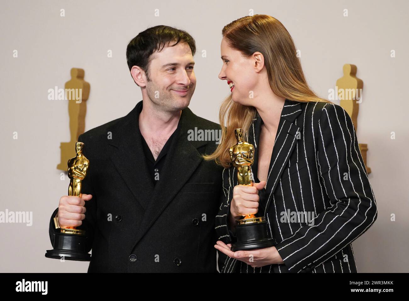 Arthur Harari, left, and Justine Triet pose with the award for best ...