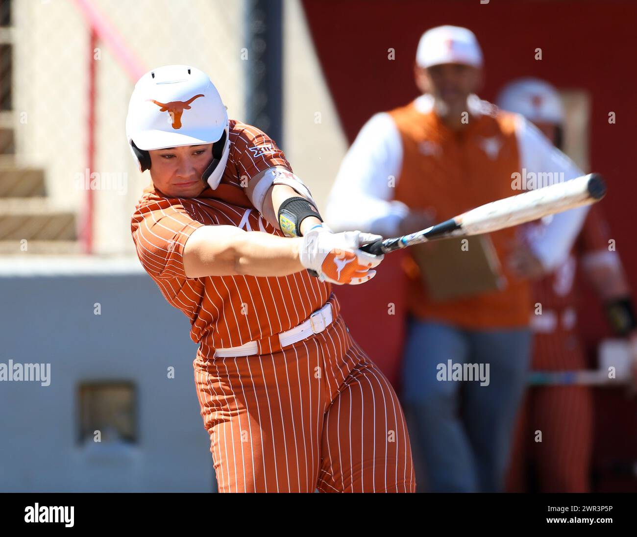 March 10, 2024: Texas utility Katie Stewart (20) at bat during an NCAA ...