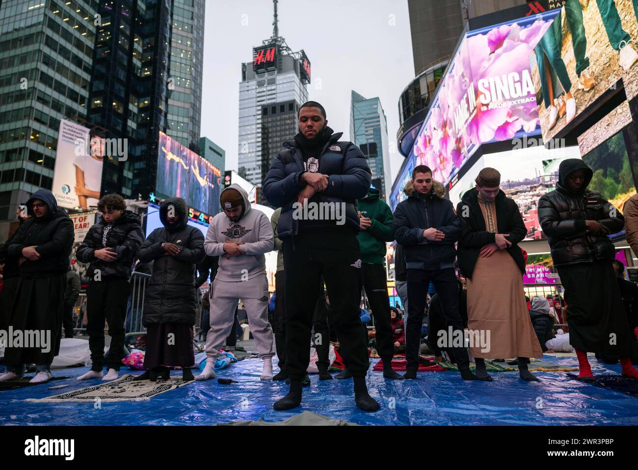 Members of the Muslim community gather for the Taraweeh prayer during a ...