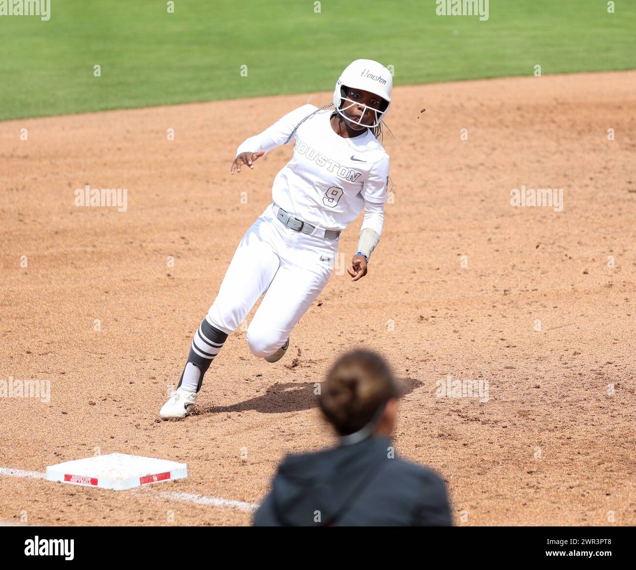 March 10, 2024: Houston baserunner Kennedy Thomas (9) heads to third ...