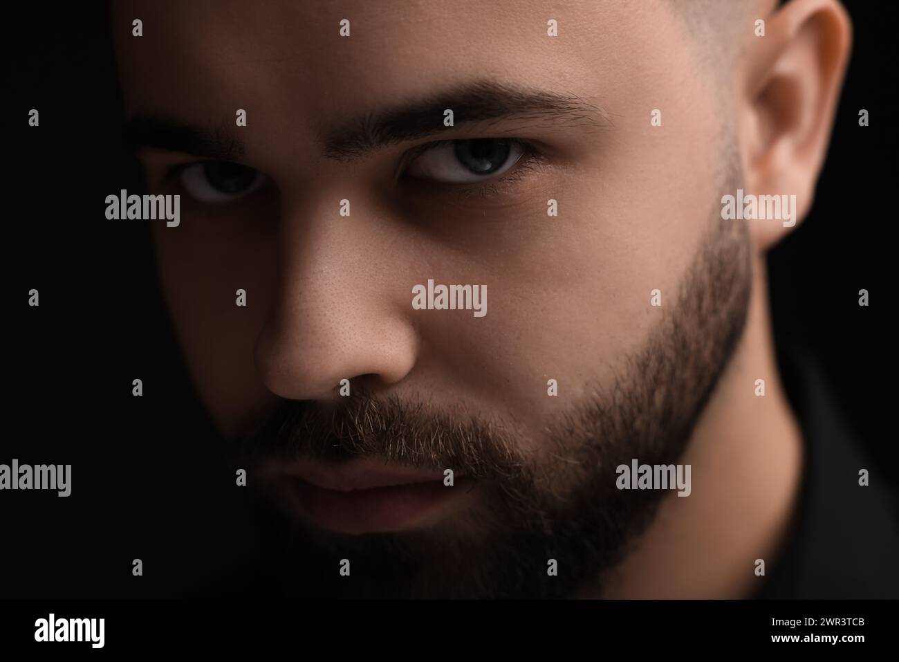 Evil eye. Man with scary eyes on black background Stock Photo - Alamy