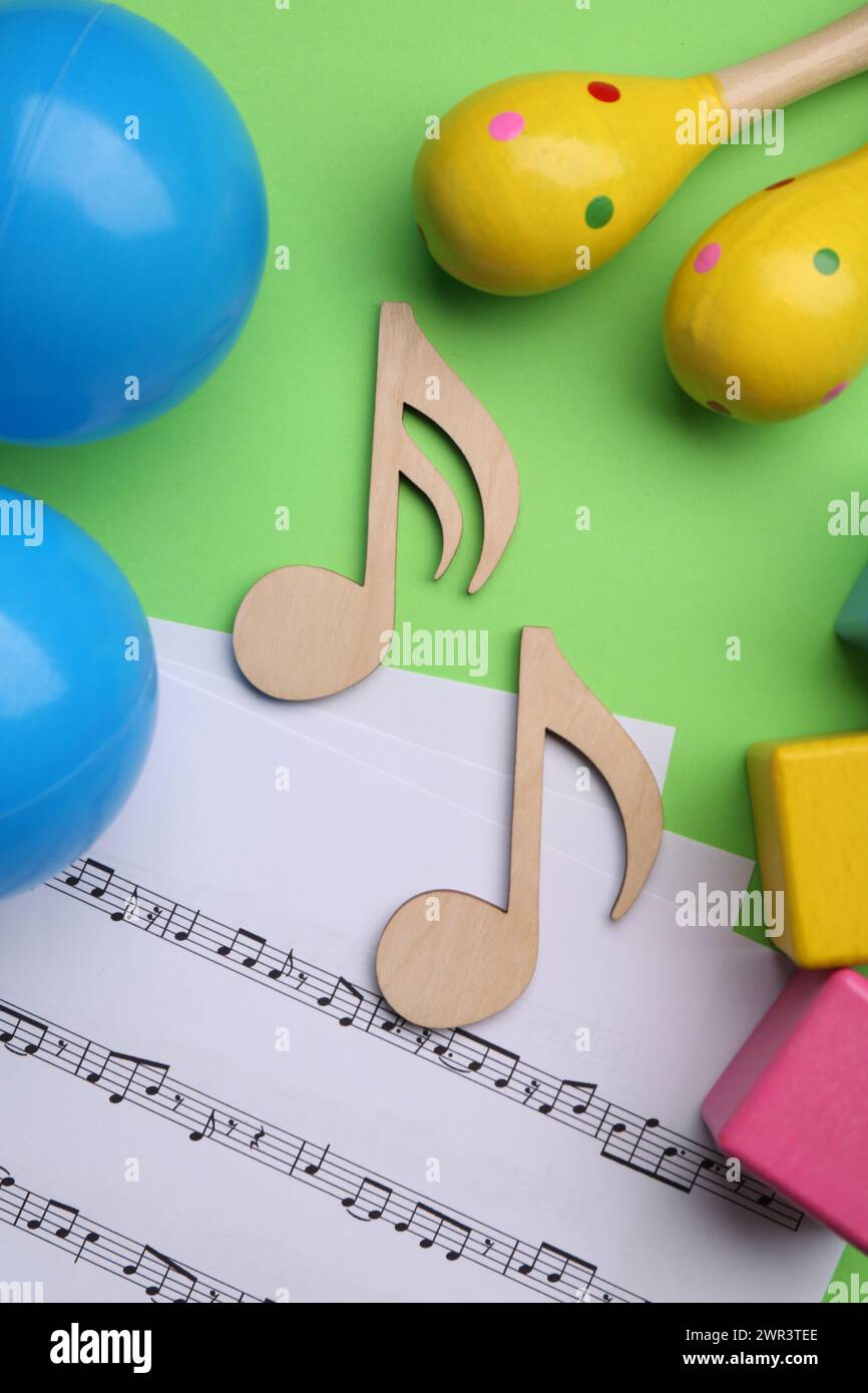 Tools for creating baby songs. Flat lay composition with wooden notes ...