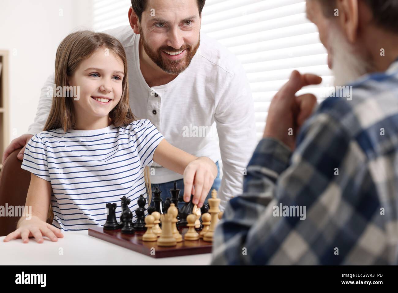 Father daughter playing chess in hi-res stock photography and images ...