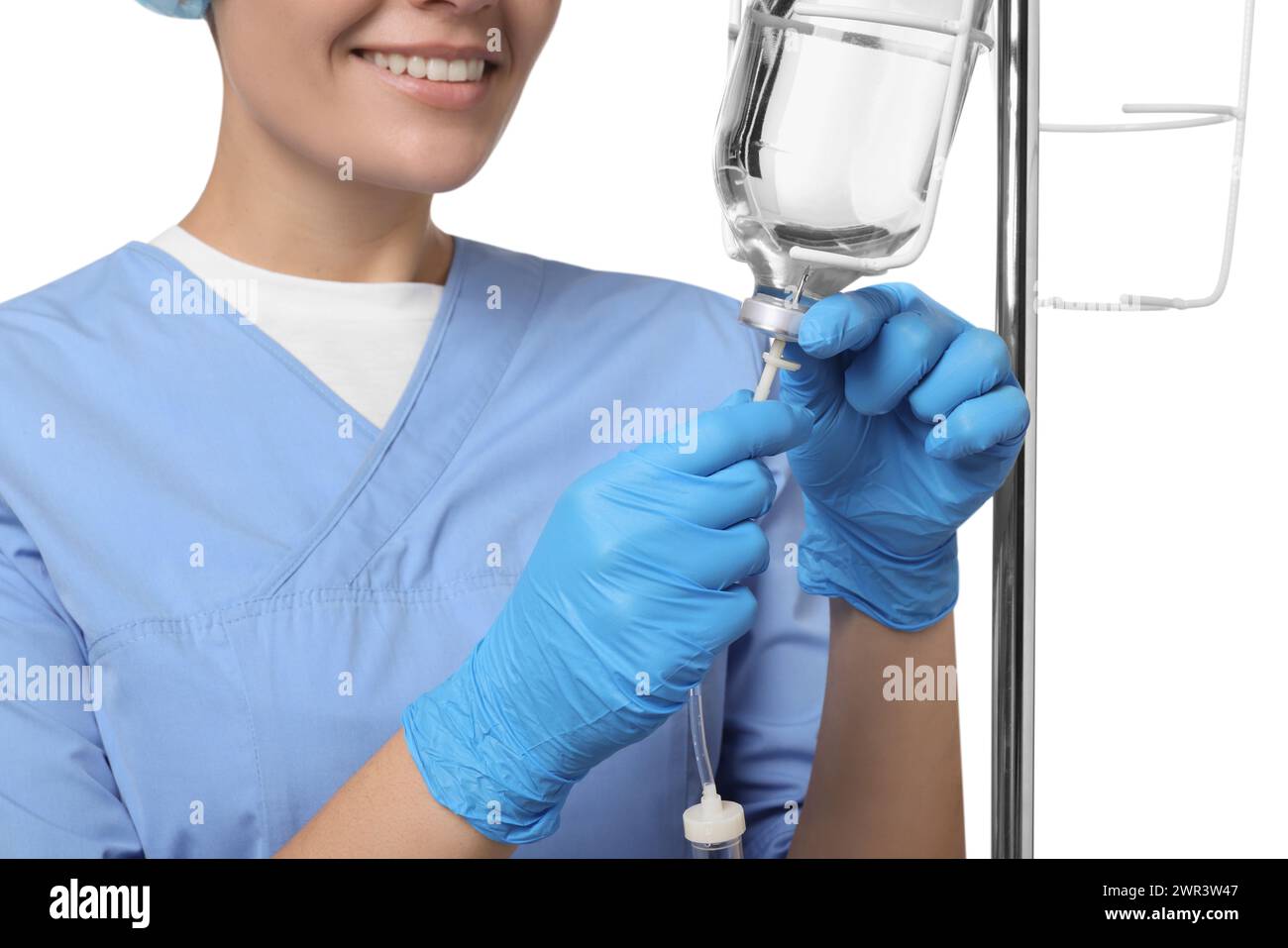 Nurse setting up IV drip on white background, closeup Stock Photo - Alamy