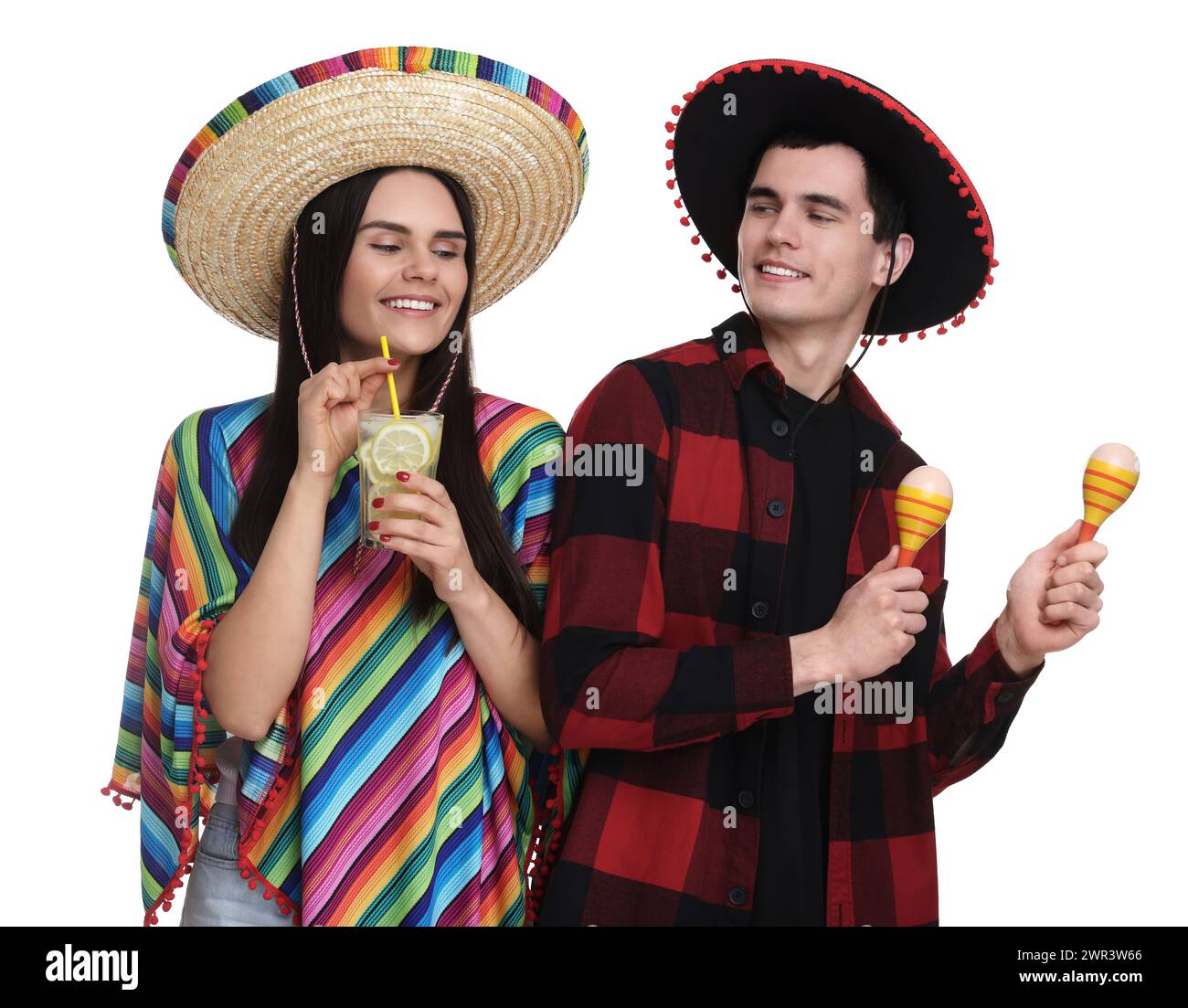 Lovely couple in Mexican sombrero hats with cocktail and maracas on ...