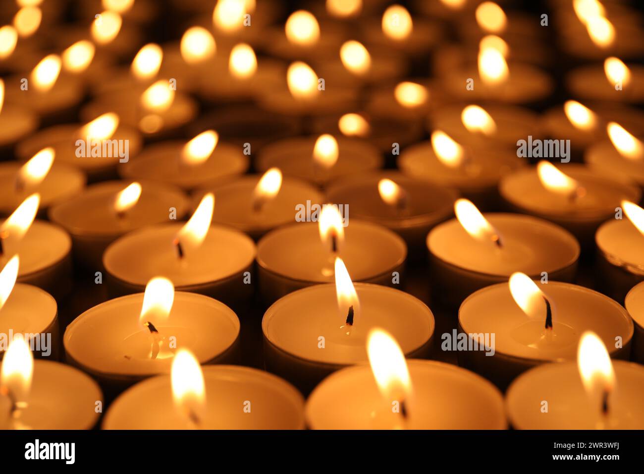 Many burning candles as background. Memory day Stock Photo - Alamy