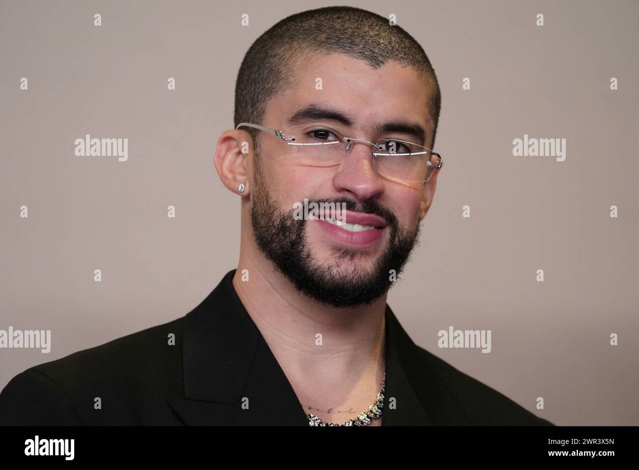Bad Bunny poses in the press room at the Oscars on Sunday, March 10 ...
