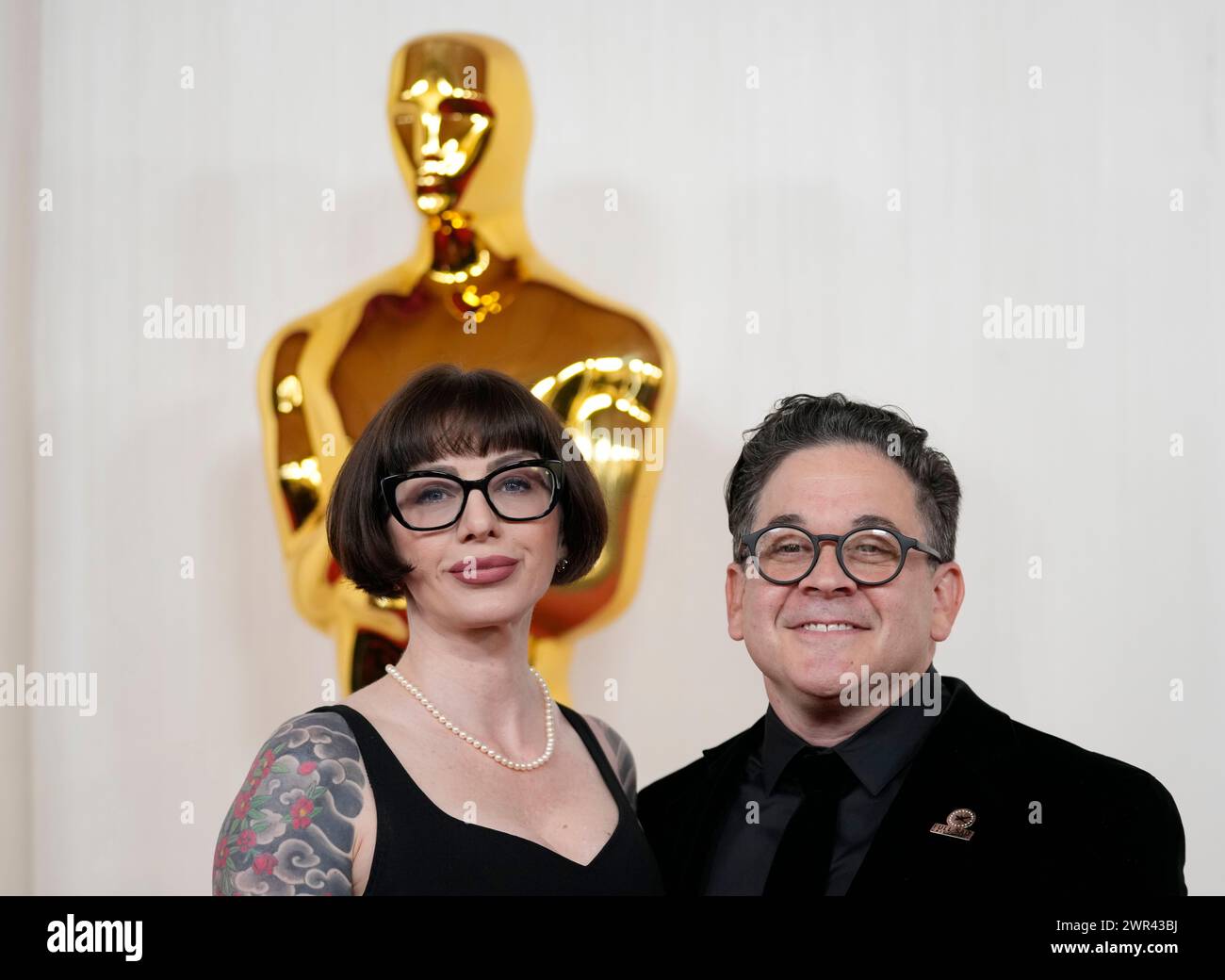 Abbye Brown, left, and Gary Rizzo arrive at the Oscars on Sunday, March ...