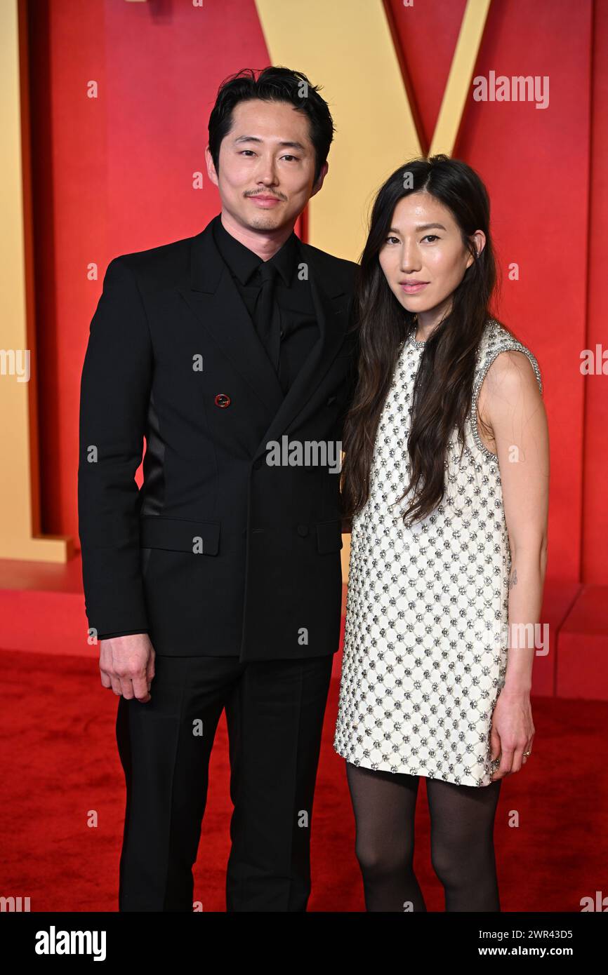 Steven Yeun and Joana Pak attending the Vanity Fair Oscar Party held at ...