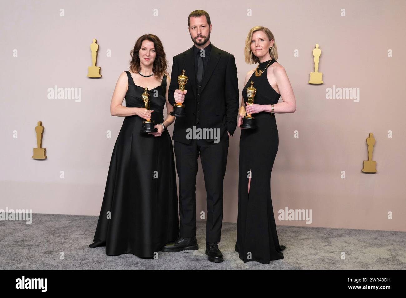 Raney Aronson-Rath, from left, Mstyslav Chernov, and Michelle Mizner ...