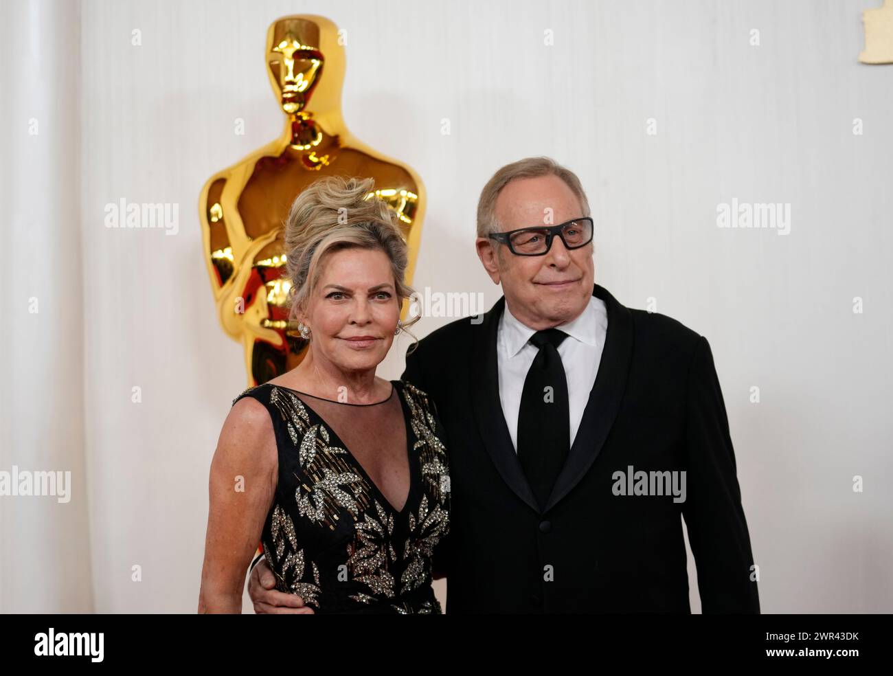 Stephanie Haymes Roven, left,and Charles Roven arrive at the Oscars on ...