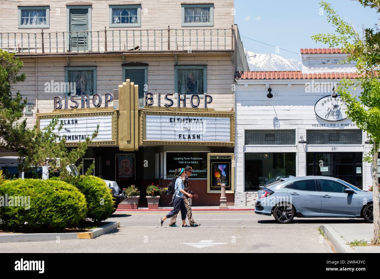 Pedestrians walk by the Bishop Theater on North Main Street in the City ...
