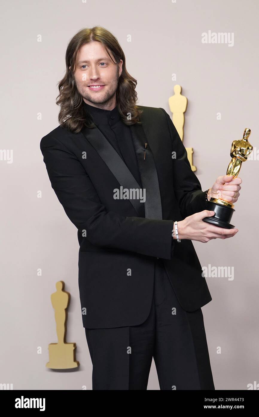 Ludwig Goransson poses in the press room with the award for best ...