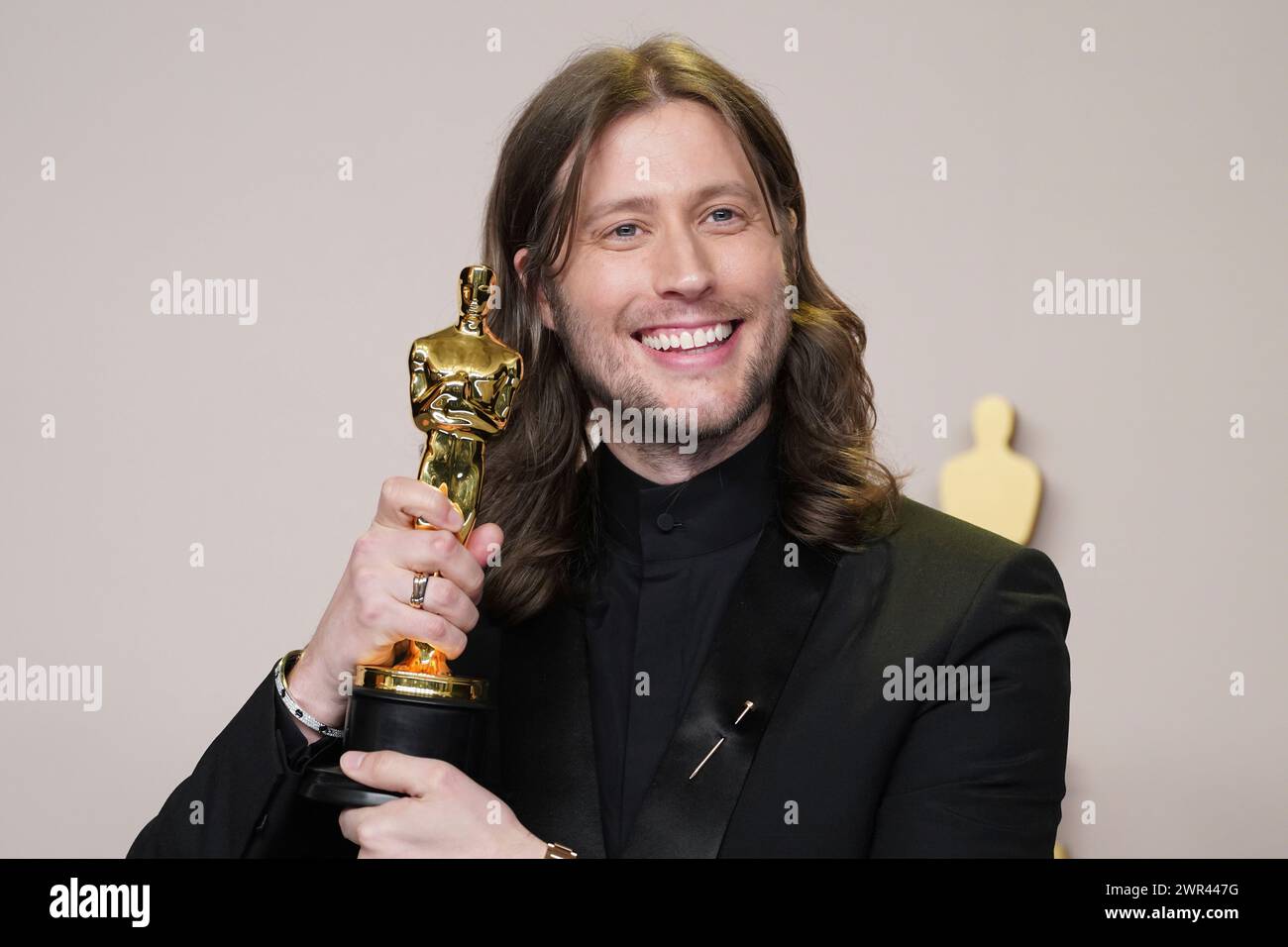 Ludwig Goransson poses in the press room with the award for best ...
