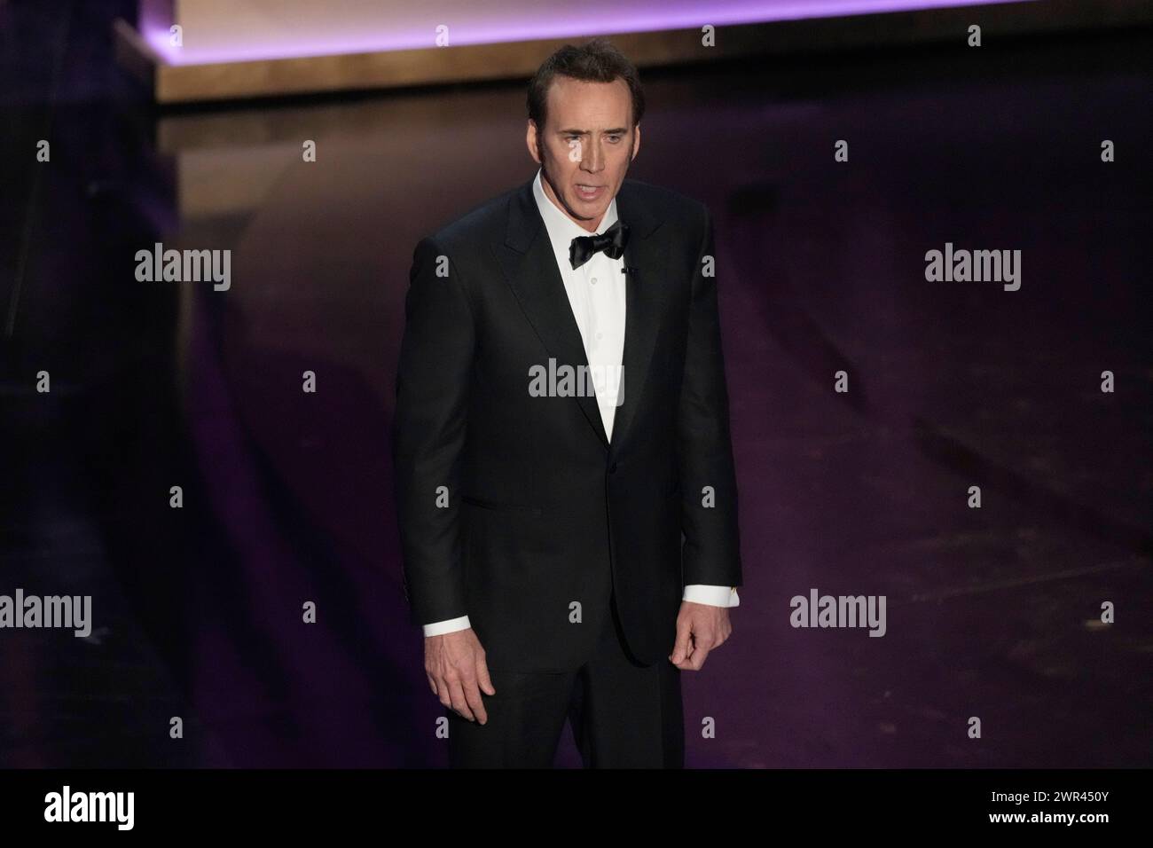 Nicolas Cage presents the award for best performance by an actor in a ...