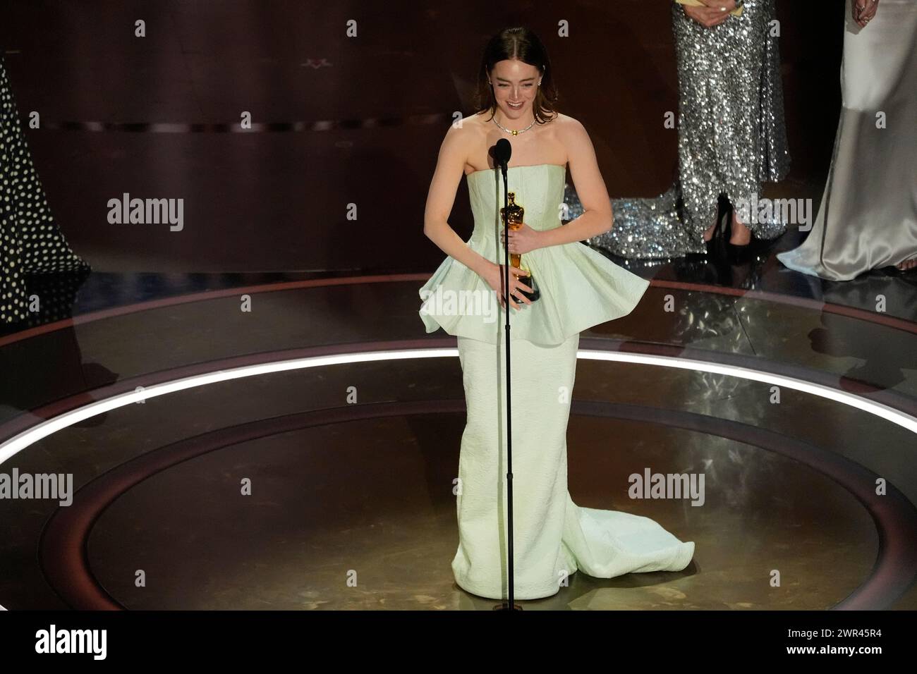Emma Stone accepts the award for best performance by an actress in a ...