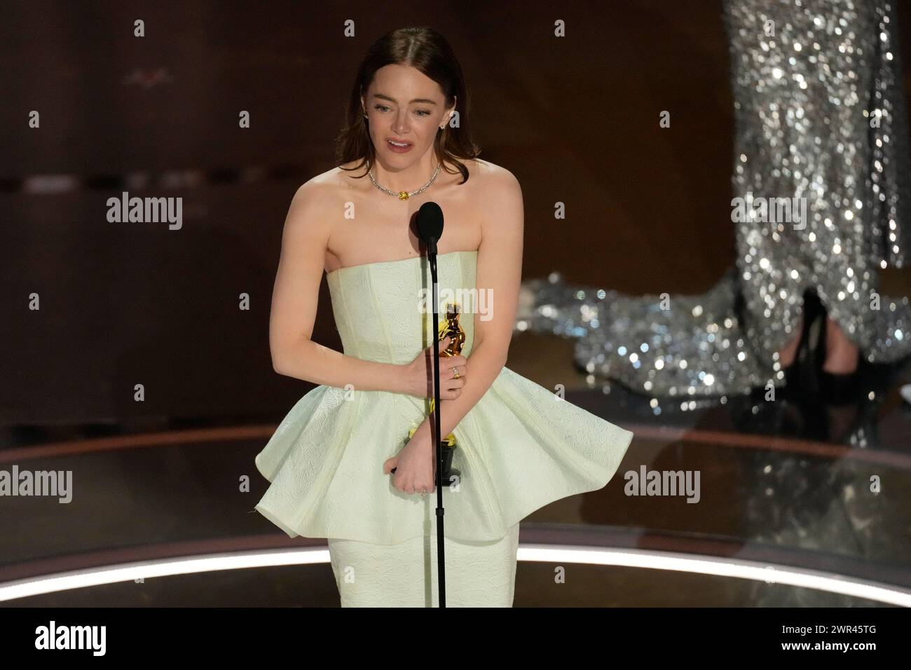 Emma Stone accepts the award for best performance by an actress in a ...