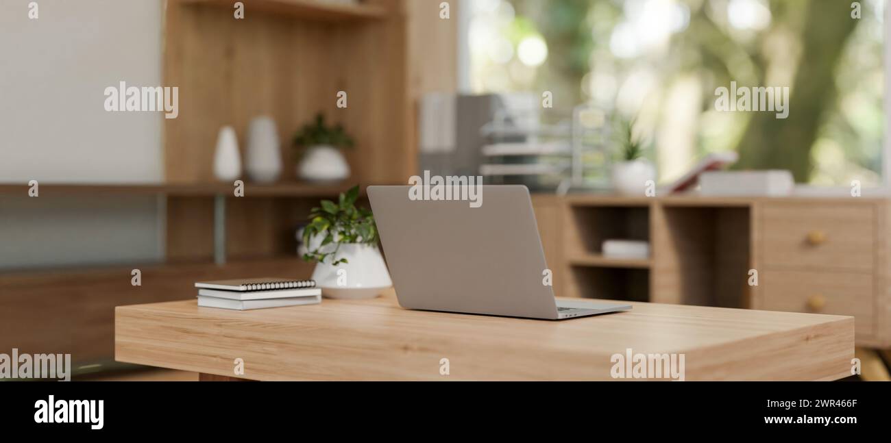 A back view image of a laptop computer on a wooden coffee table in a ...
