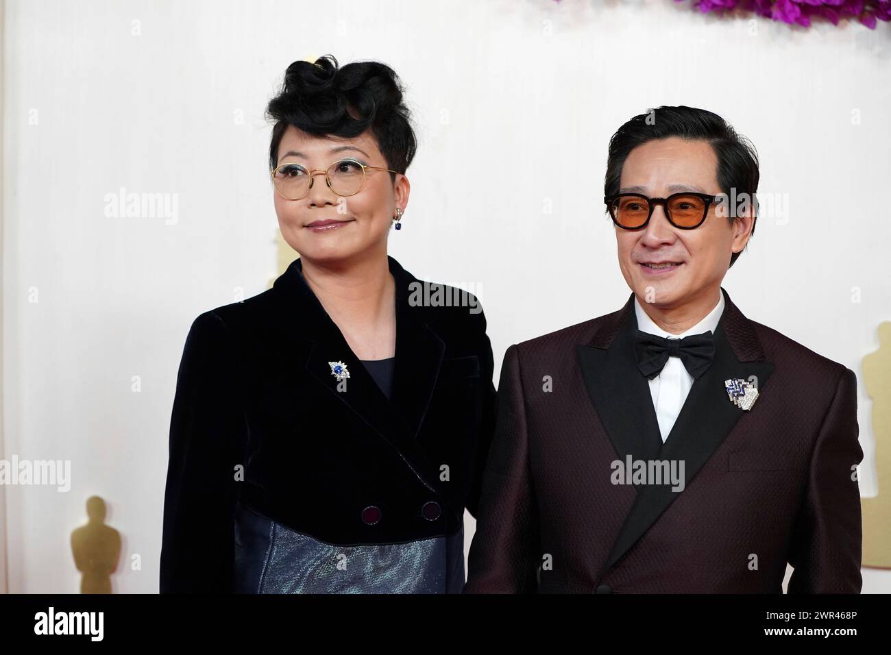From left, Echo Quan and Ke Huy Quan arrive at the Oscars on Sunday ...