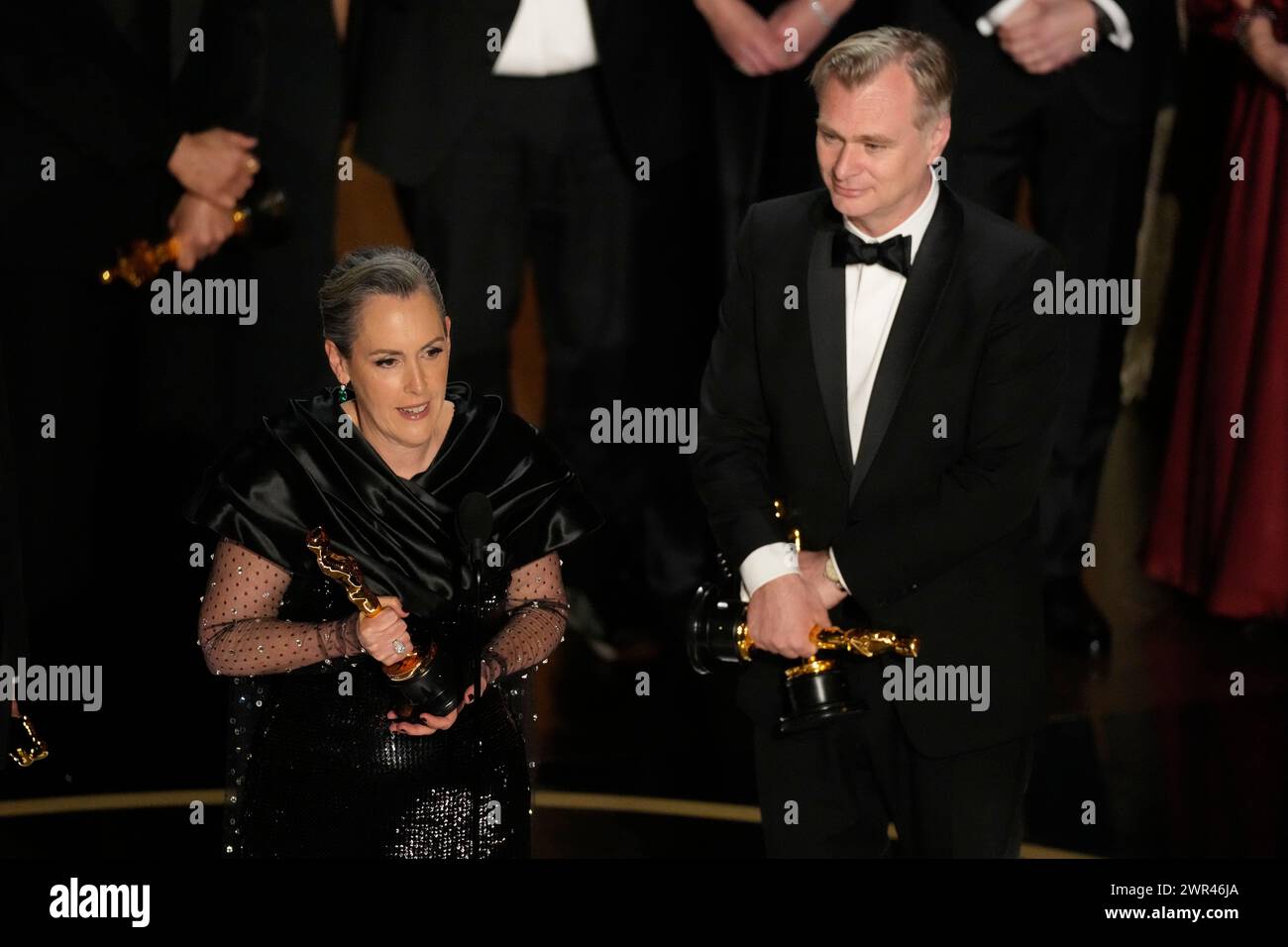 Emma Thomas, left, and Christopher Nolan accept the award for best ...