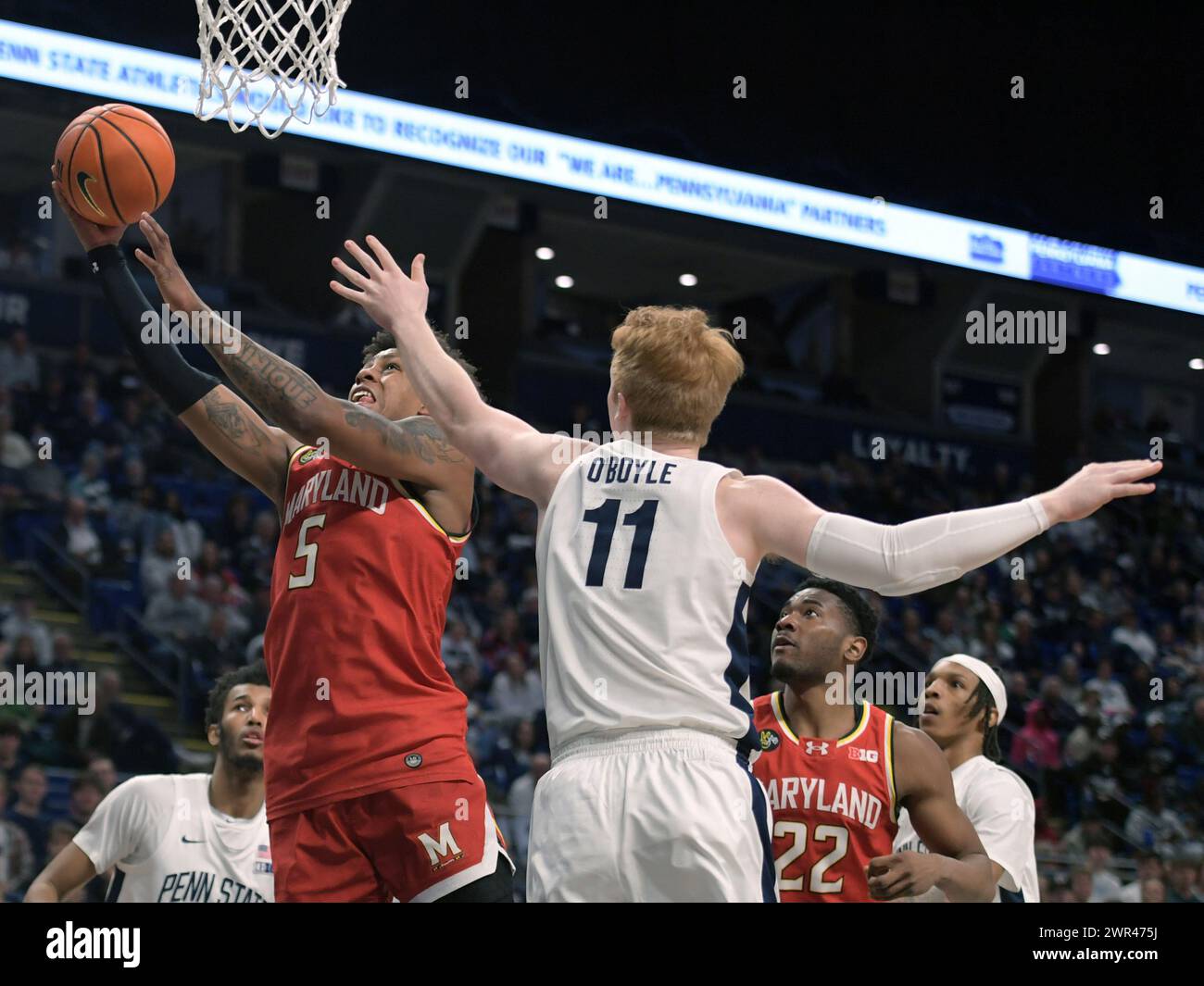 Maryland's DeShawn Harris-Smith (5) drives to the basket on Penn State ...