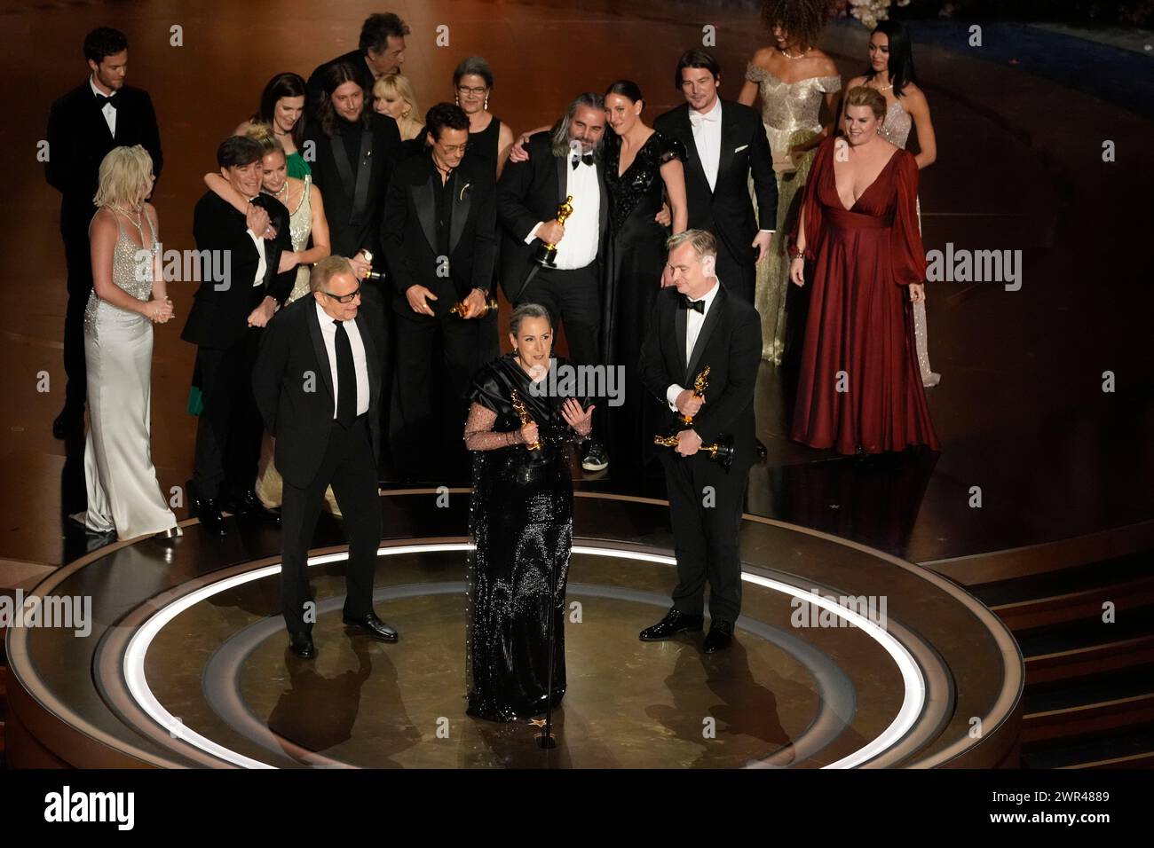 The cast and crew of "Oppenheimer" accept the award for best picture ...