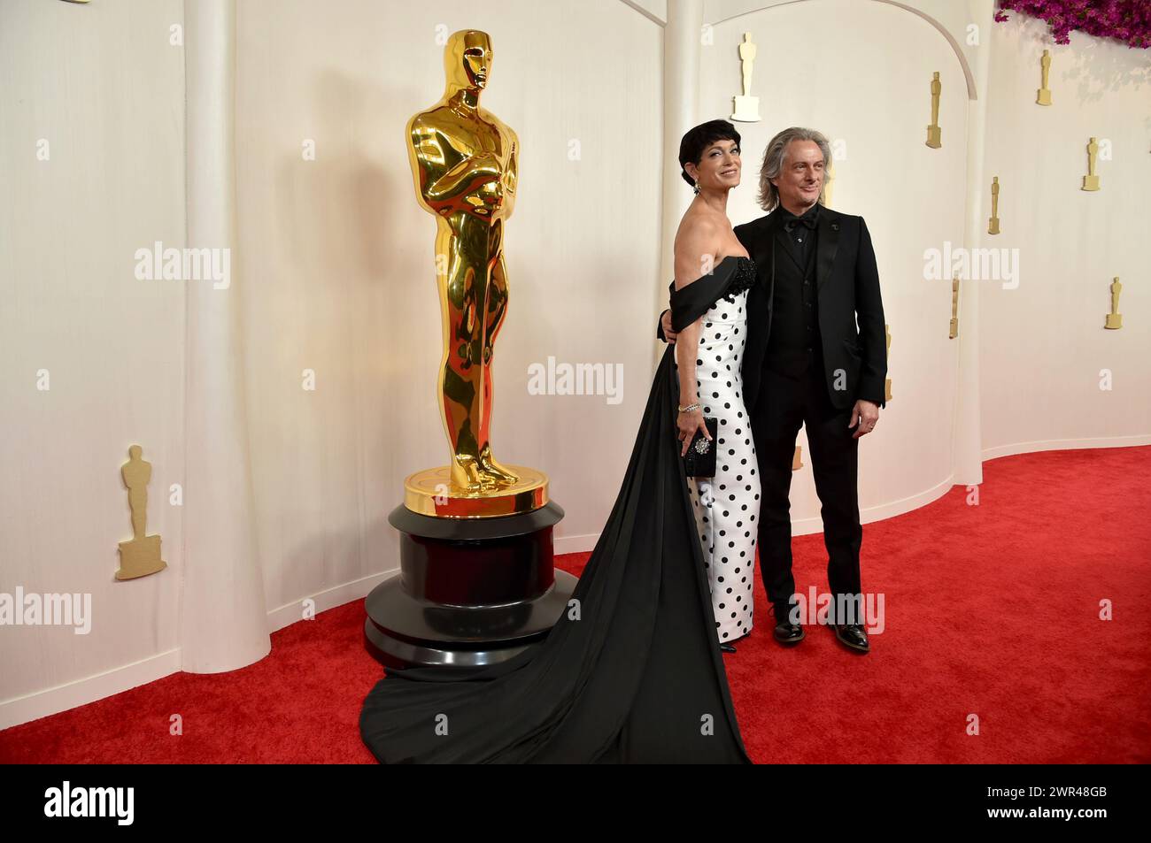 Odile Corso, left, and Bill Corso arrive at the Oscars on Sunday, March ...