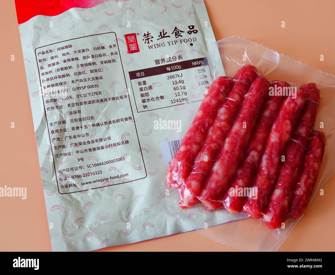 YICHANG, CHINA - MARCH 11, 2024 - A citizen shows Hongfu sausage ...