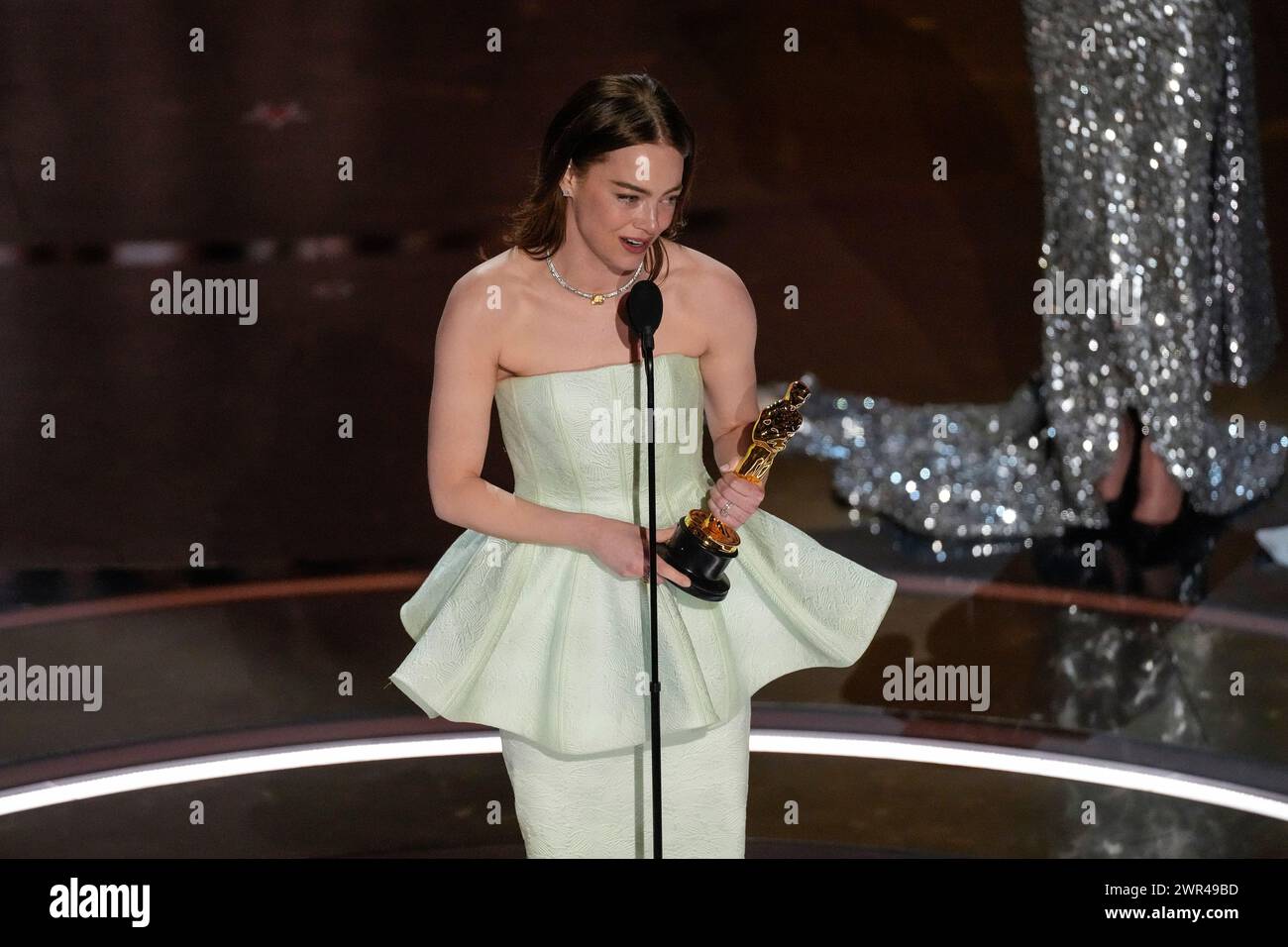 Emma Stone accepts the award for best performance by an actress in a ...