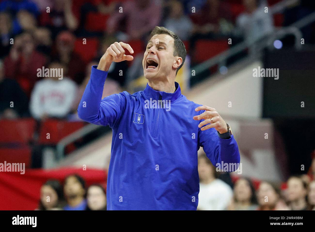 North Carolina State's DJ Horne (0) and Duke's Ryan Young (15) dive for ...