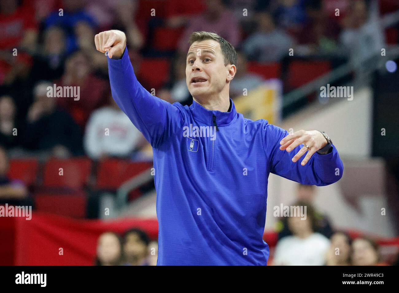 North Carolina State's DJ Horne (0) and Duke's Ryan Young (15) dive for ...