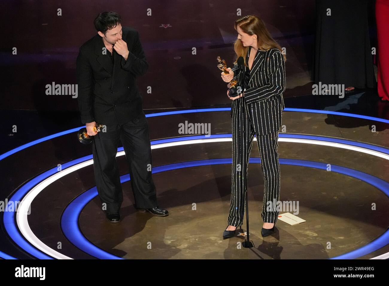 Arthur Harari, left, and Justine Triet accept the award for best ...