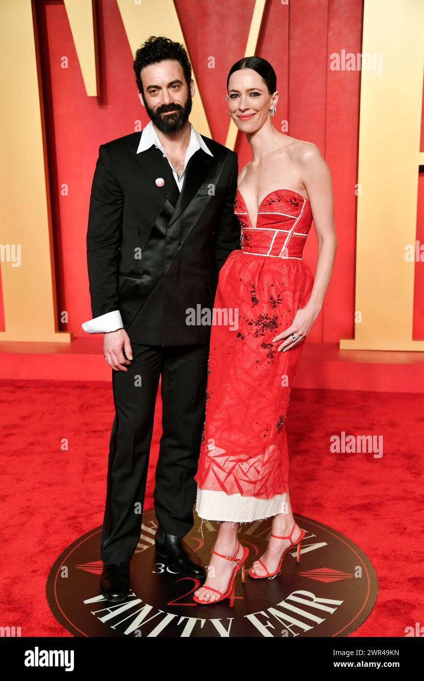 Morgan Spector, left, and Rebbecca Hall arrive at the Vanity Fair Oscar ...