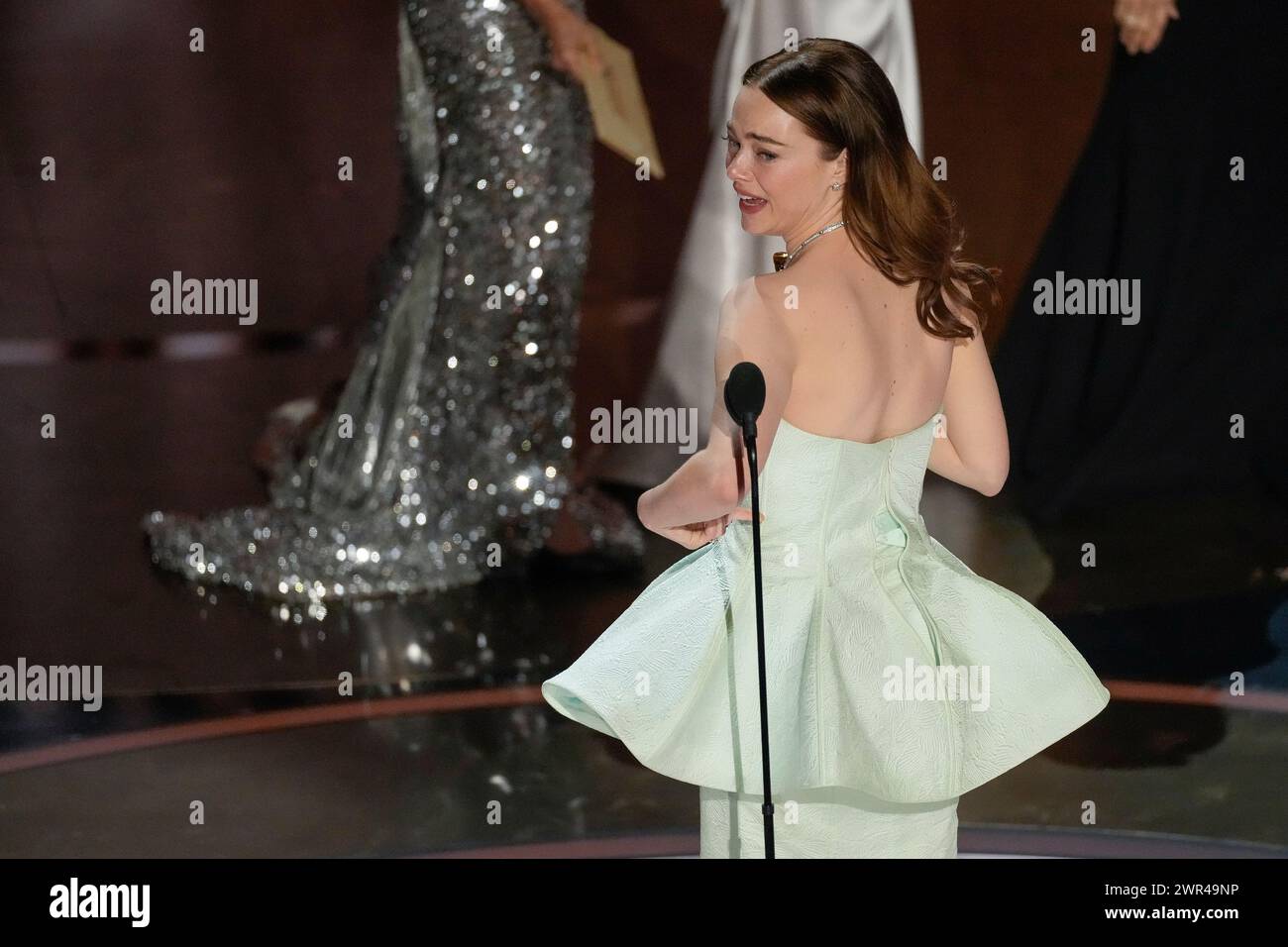 Emma Stone accepts the award for best performance by an actress in a ...