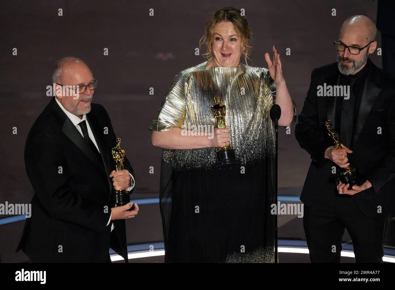 Mark Coulier, from left, Nadia Stacey and Josh Weston accept the award ...