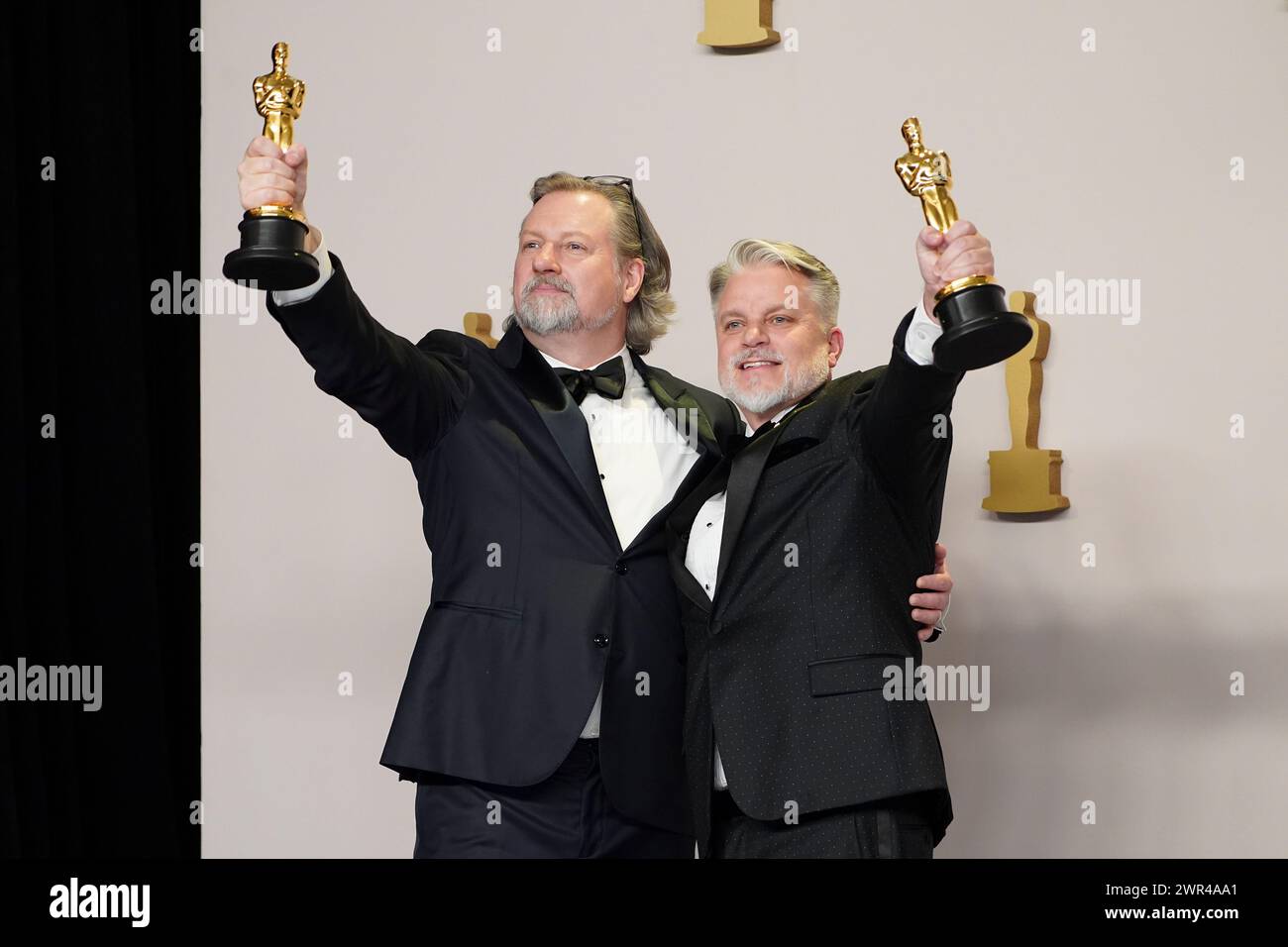 Dave Mullins, from left, Brad Booker pose in the press room with the ...
