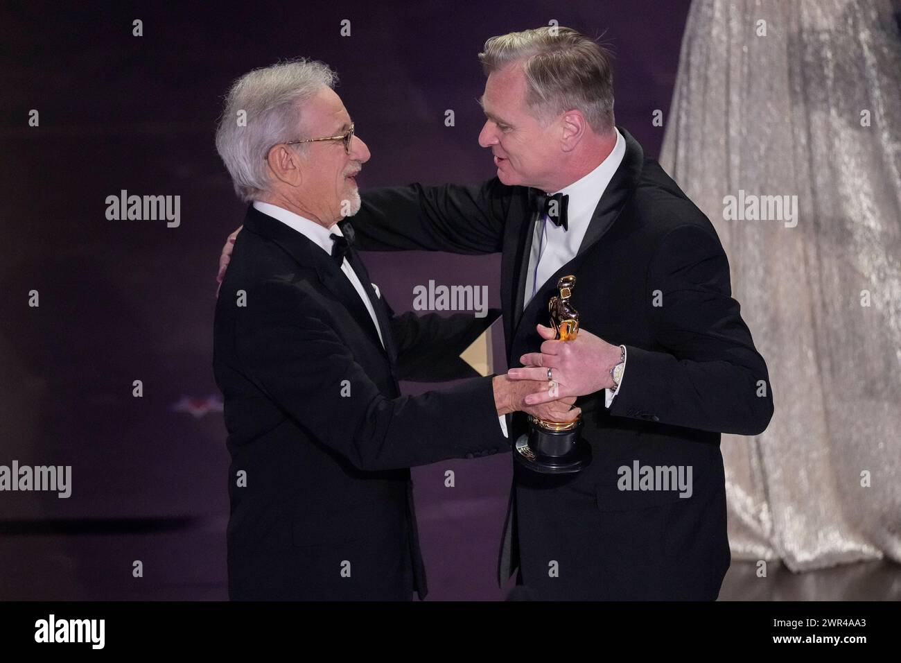 Steven Spielberg, left, and Christopher Nolan embrace as Nolan accepts ...